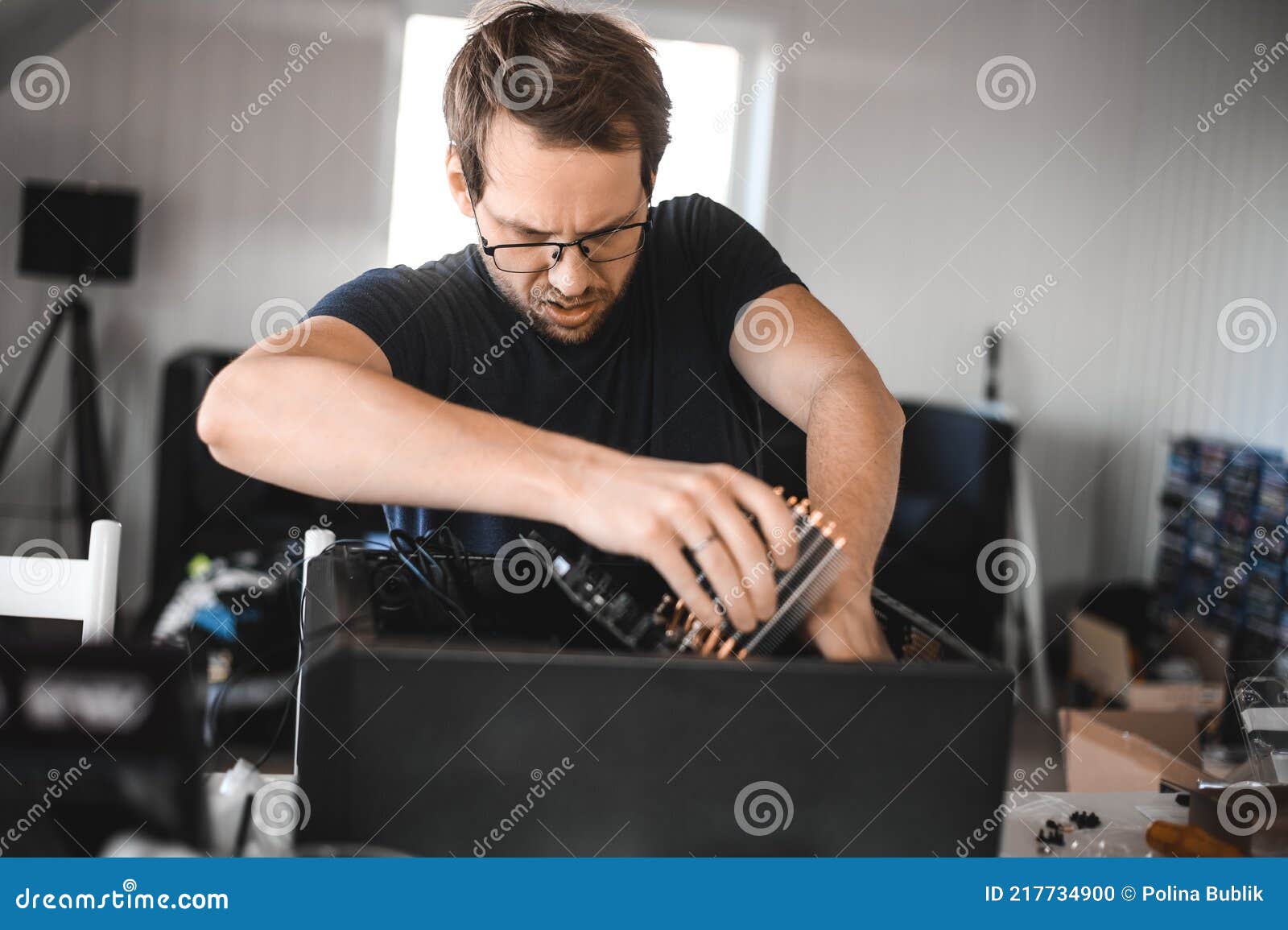 Handsome Nerd Man is Servicing Computer Motherboard and Cooler. Stock ...