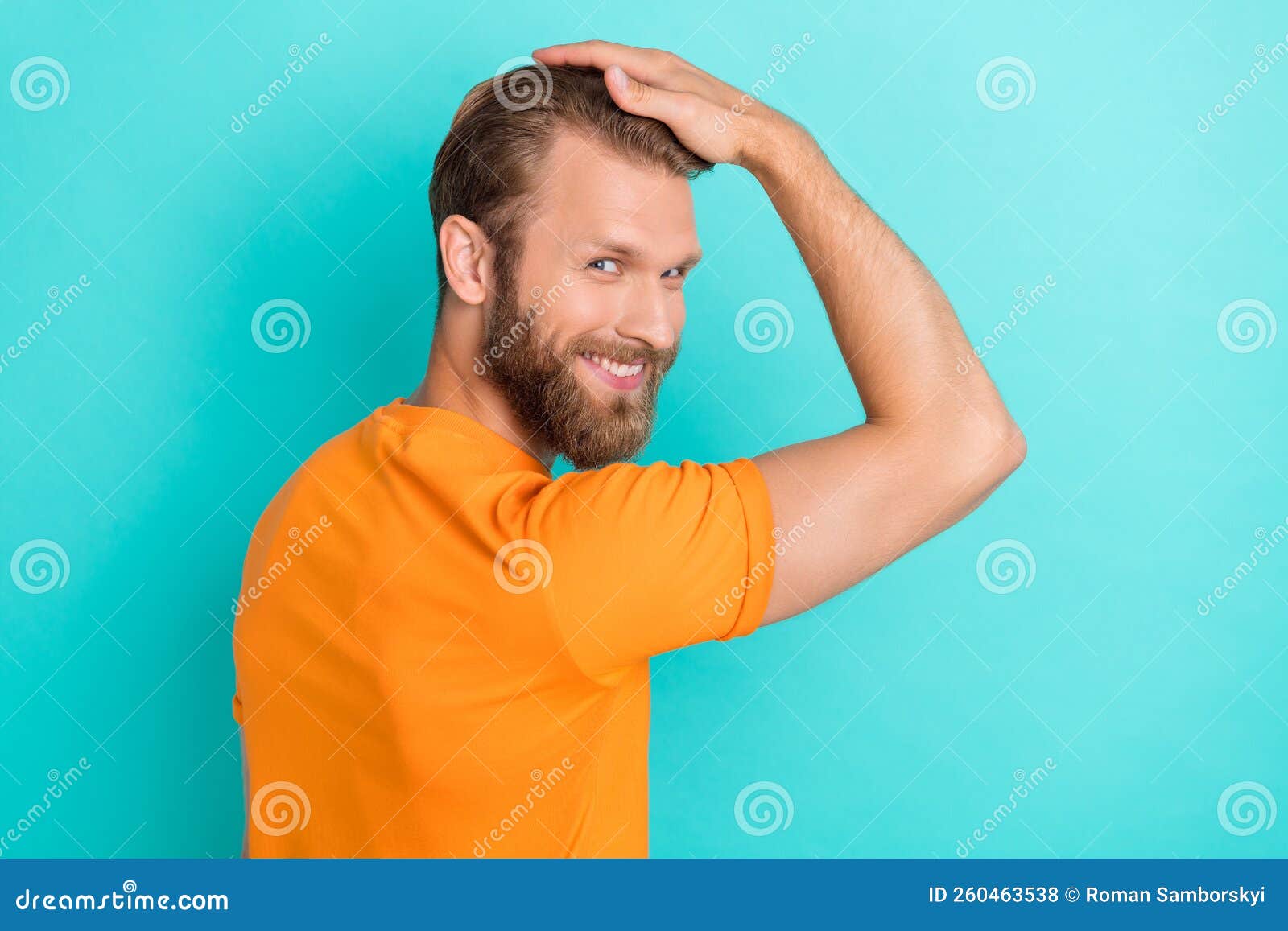 Portrait Of Handsome Positive Guy With Blond Hairdo Wear Orange T Shirt
