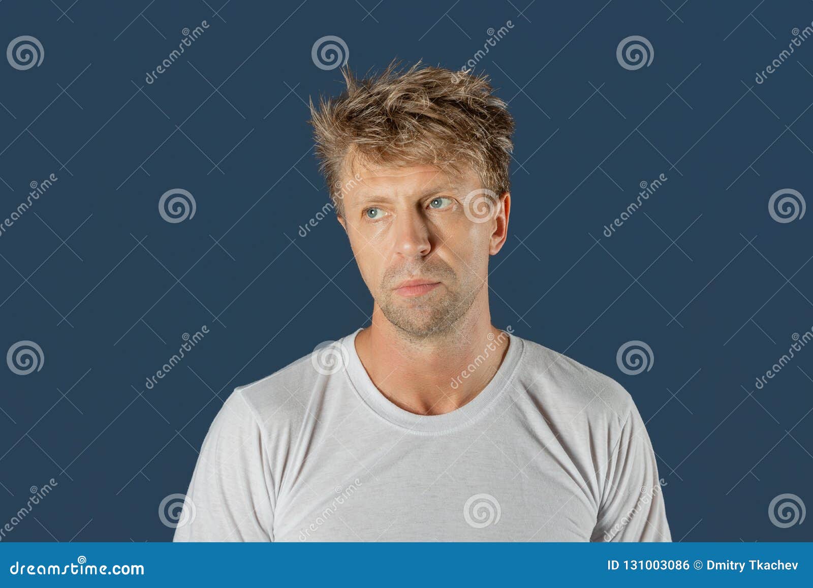 Portrait of Handsome Sad Thoughtful Man Isolated Over Blue Background ...