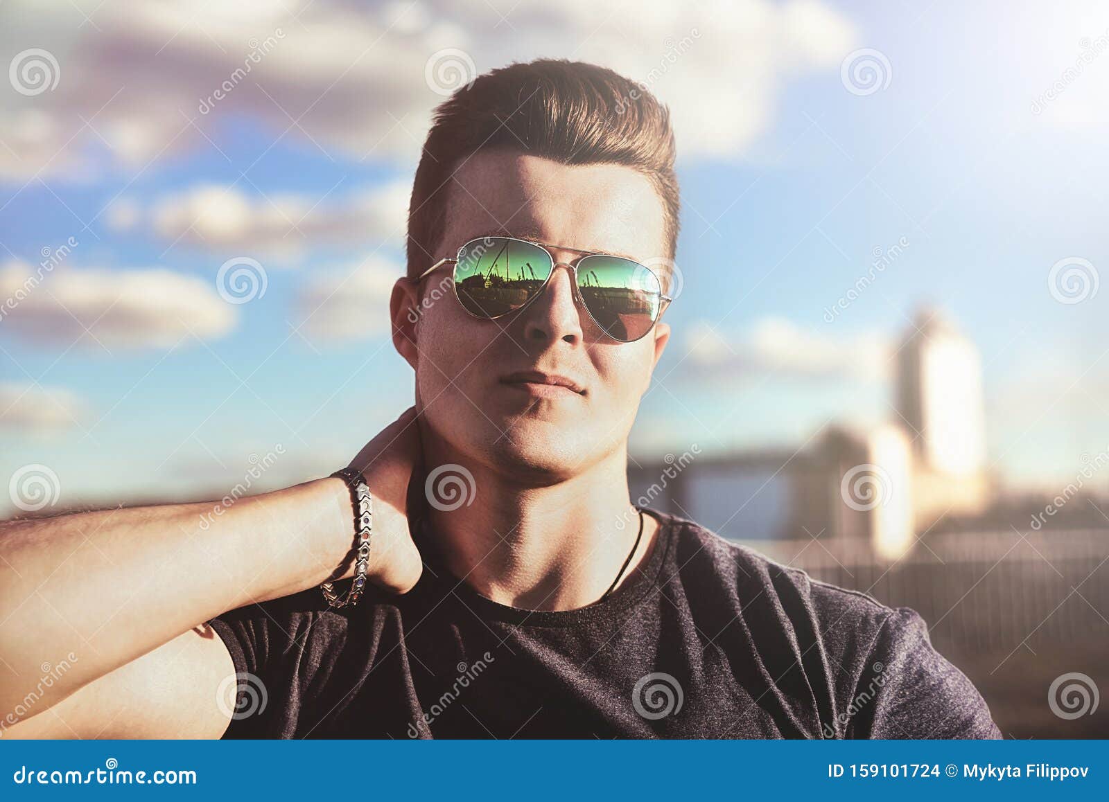 Portrait of a Handsome Stylish Guy in Sunglasses Who Poses Outdoors ... Portrait of a Handsome Stylish Guy in Sunglasses Who Poses Outdoors ...