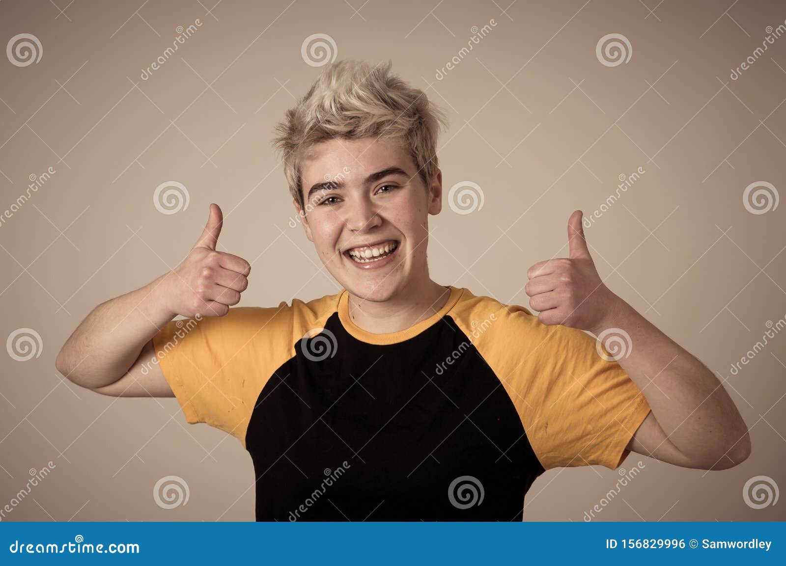 Portrait of Handsome Transgender Teenager Making Thumbs Up Gesture ... Portrait of Handsome Transgender Teenager Making Thumbs Up Gesture ...