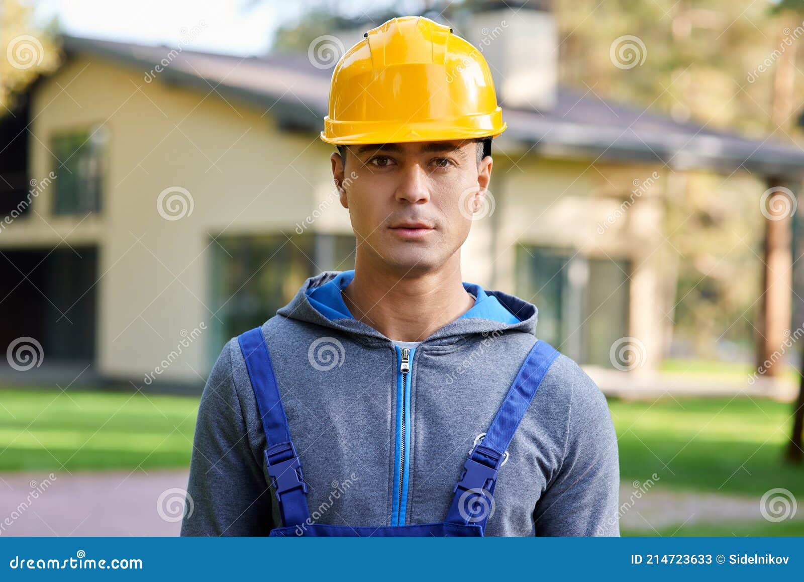 Portrait of Handsome Young Male Engineer in Hard Hat Looking at Camera ...