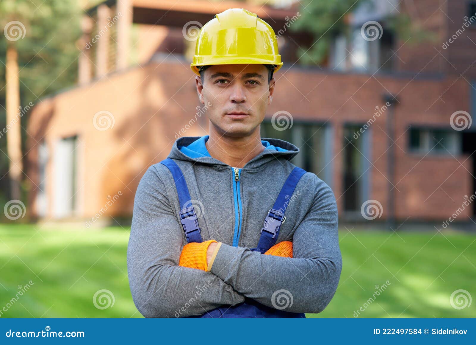 Portrait of Handsome Young Male Engineer in Hard Hat Looking at Camera ...