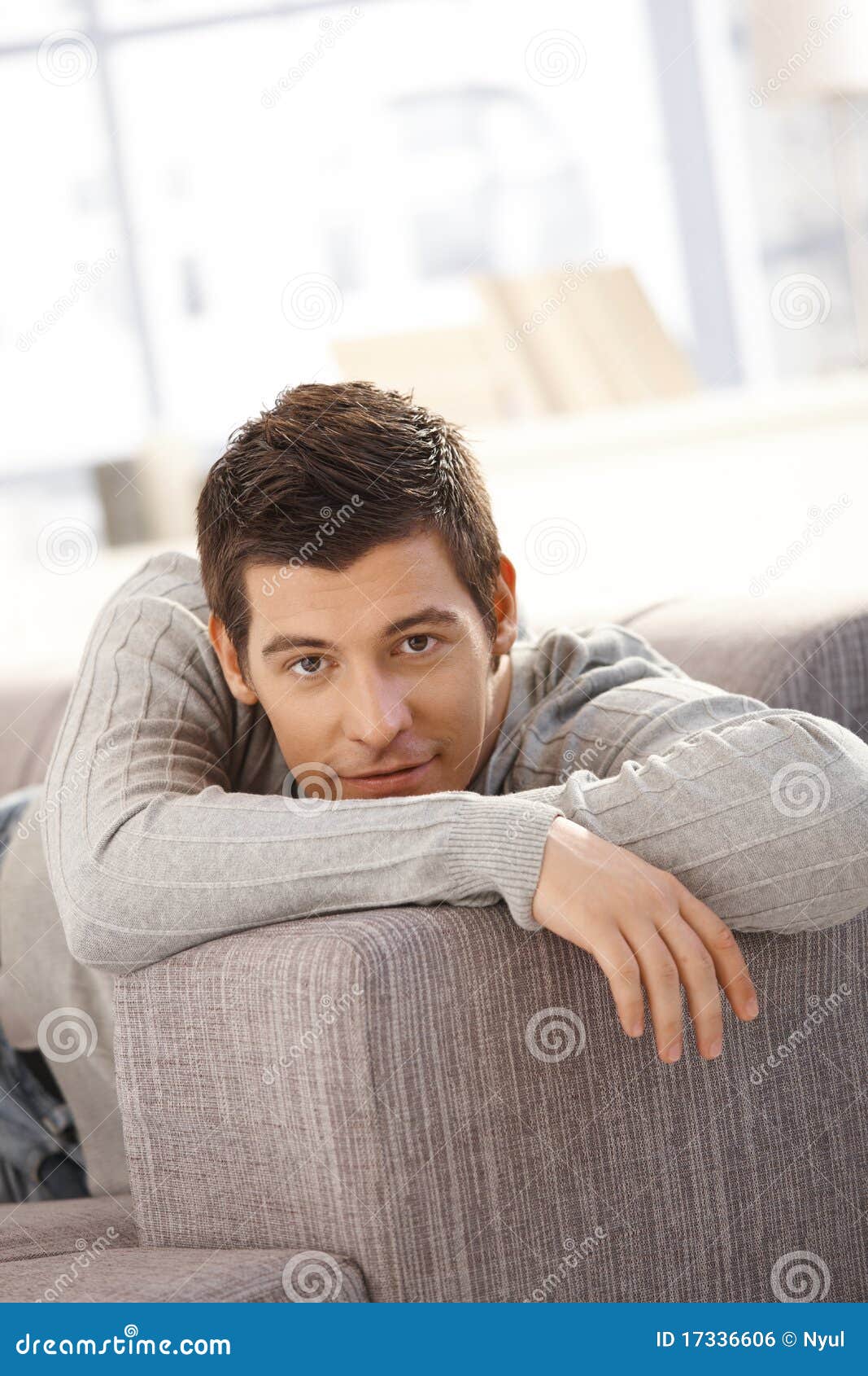 Portrait of Handsome Young Man on Couch Stock Photo - Image of ...