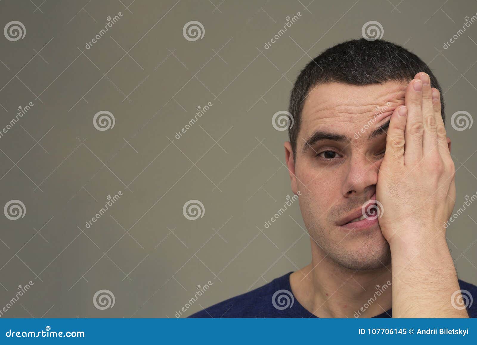 Portrait of a Handsome Young Man with His Hand on Face Stock Image ...