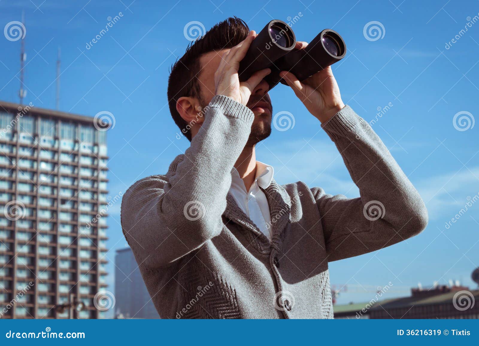 Portrait of a Handsome Young Man Looking through Binoculars Stock Image ...