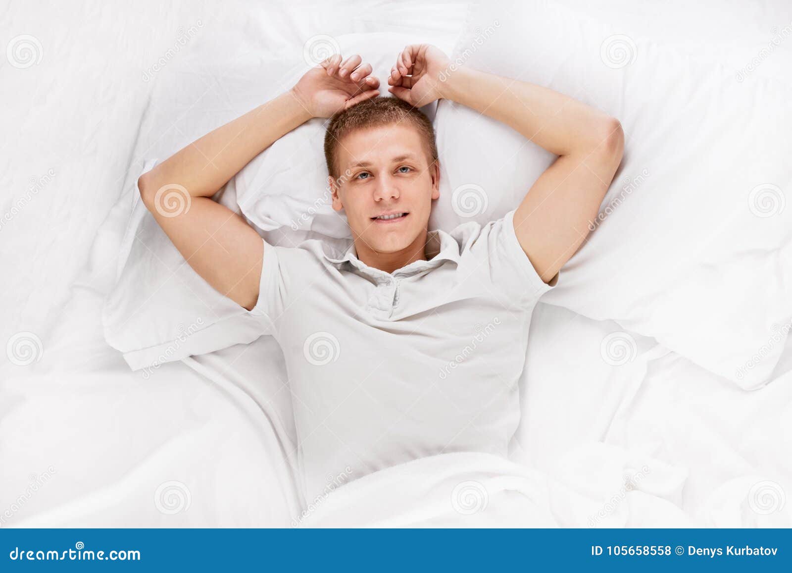 Handsome man in bed stock photo. Image of casual, handsome - 105658558
