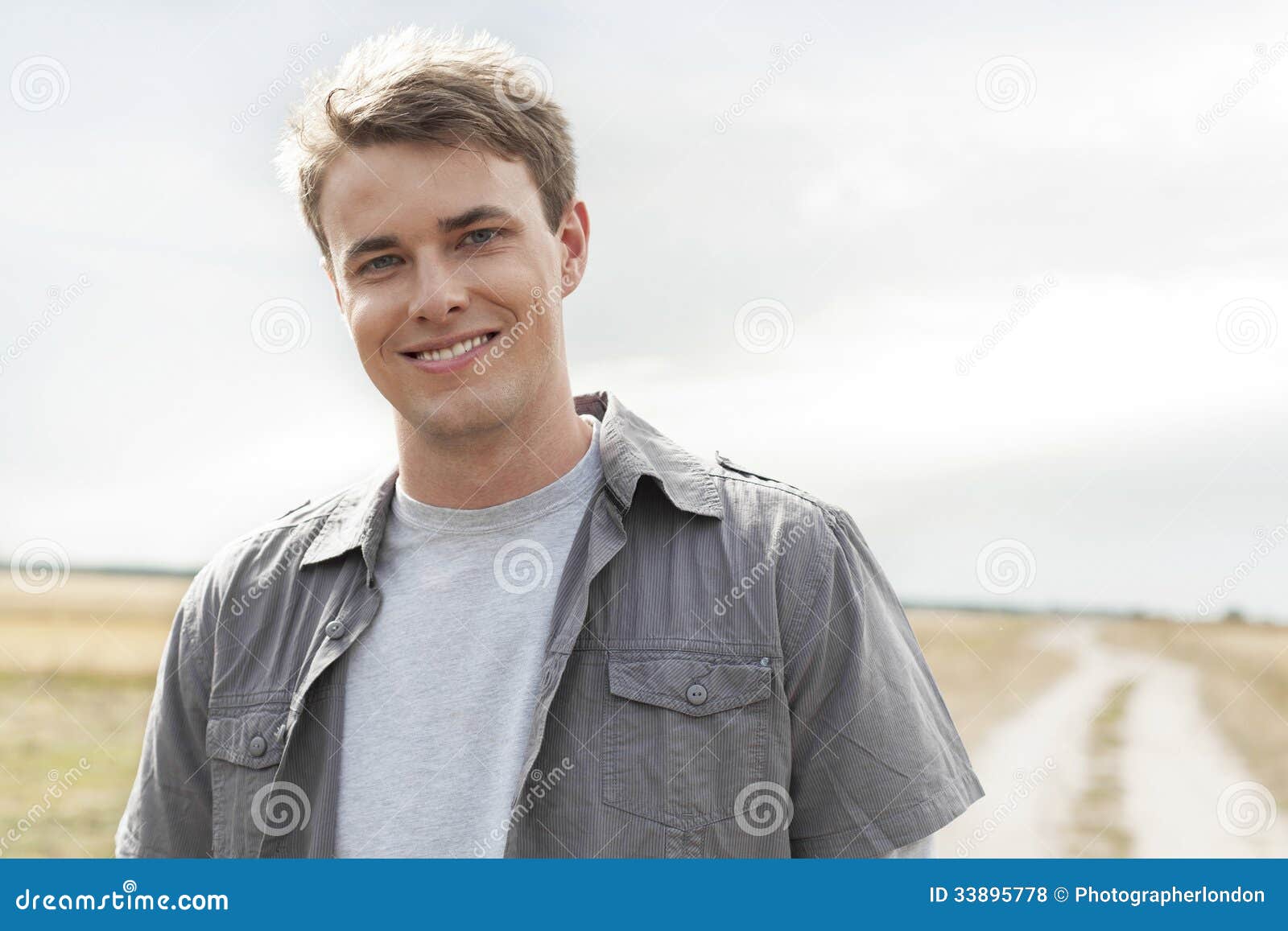 Portrait of Handsome Young Man Standing on Field Stock Photo - Image of ...