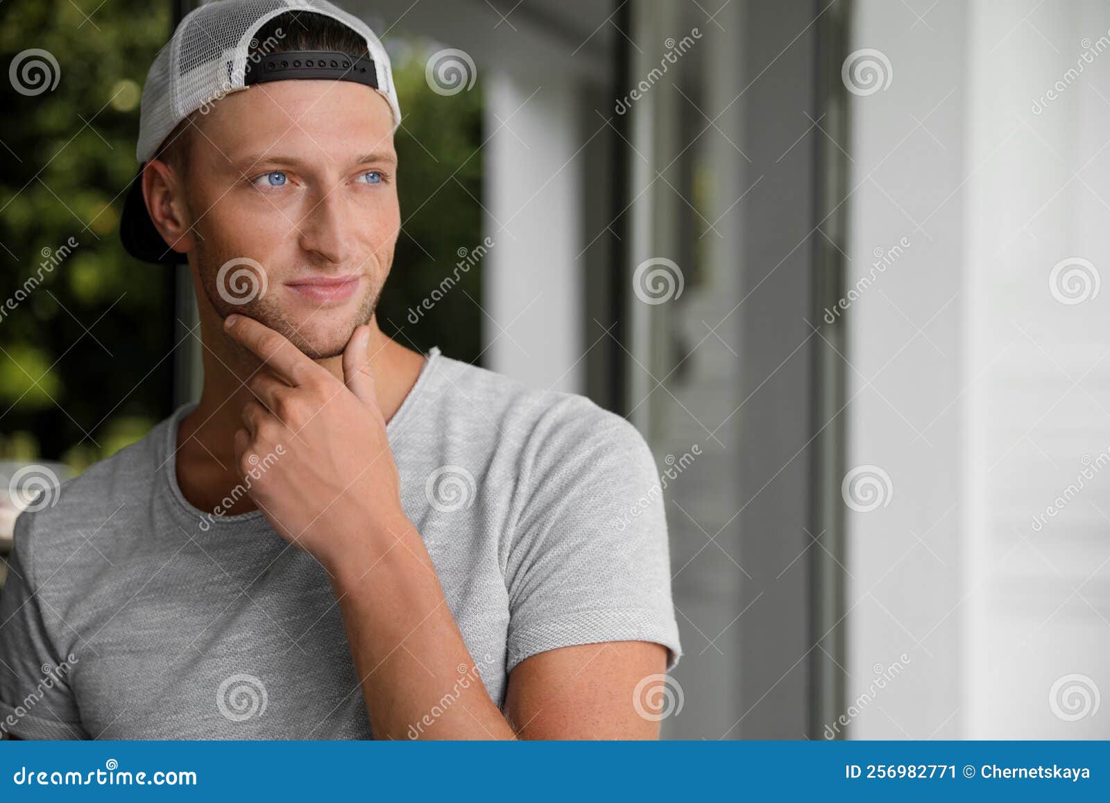 Portrait of Handsome Young Man in Stylish Cap Outdoors, Space for Text ...