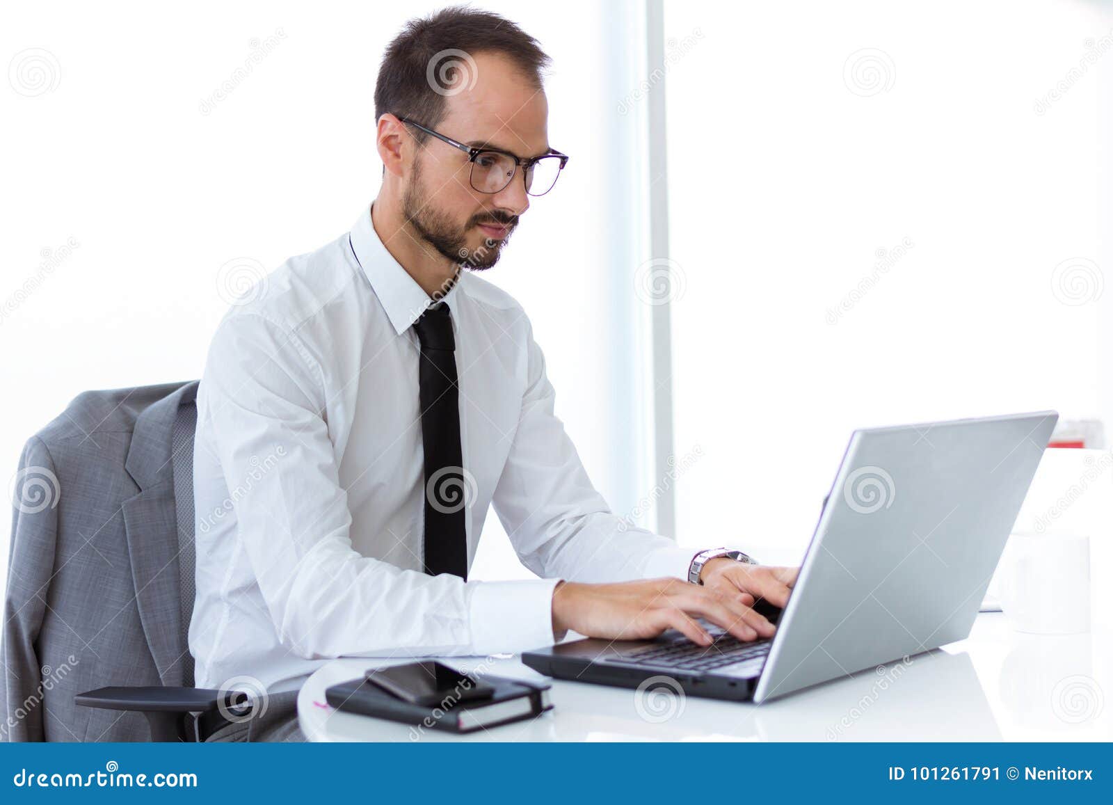 Handsome Young Man Working with Laptop in the Office. Stock Image ... Handsome Young Man Working with Laptop in the Office. Stock Image ...