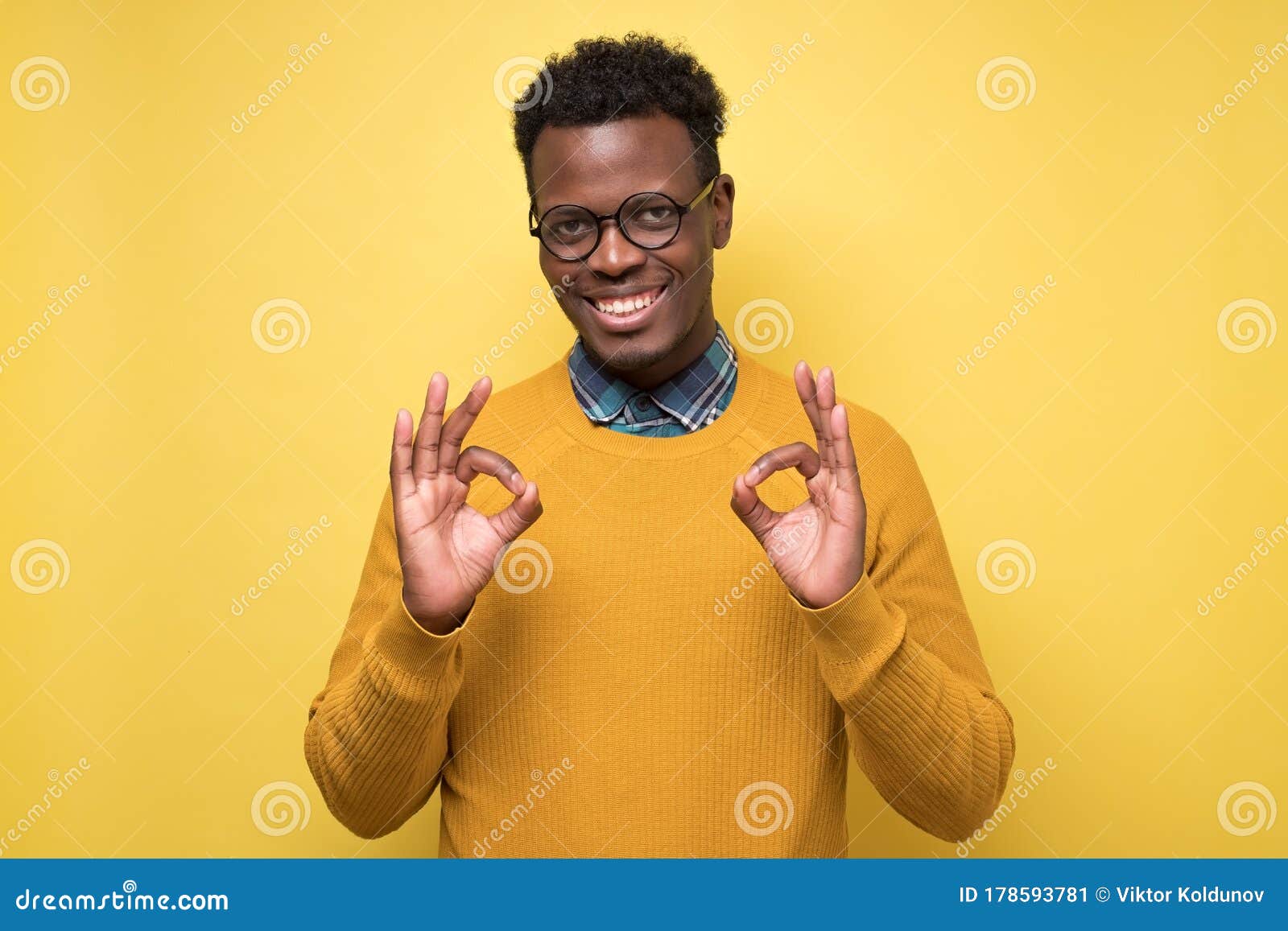 Portrait Of Happy African American Man In Glasses Showing Ok Sign And