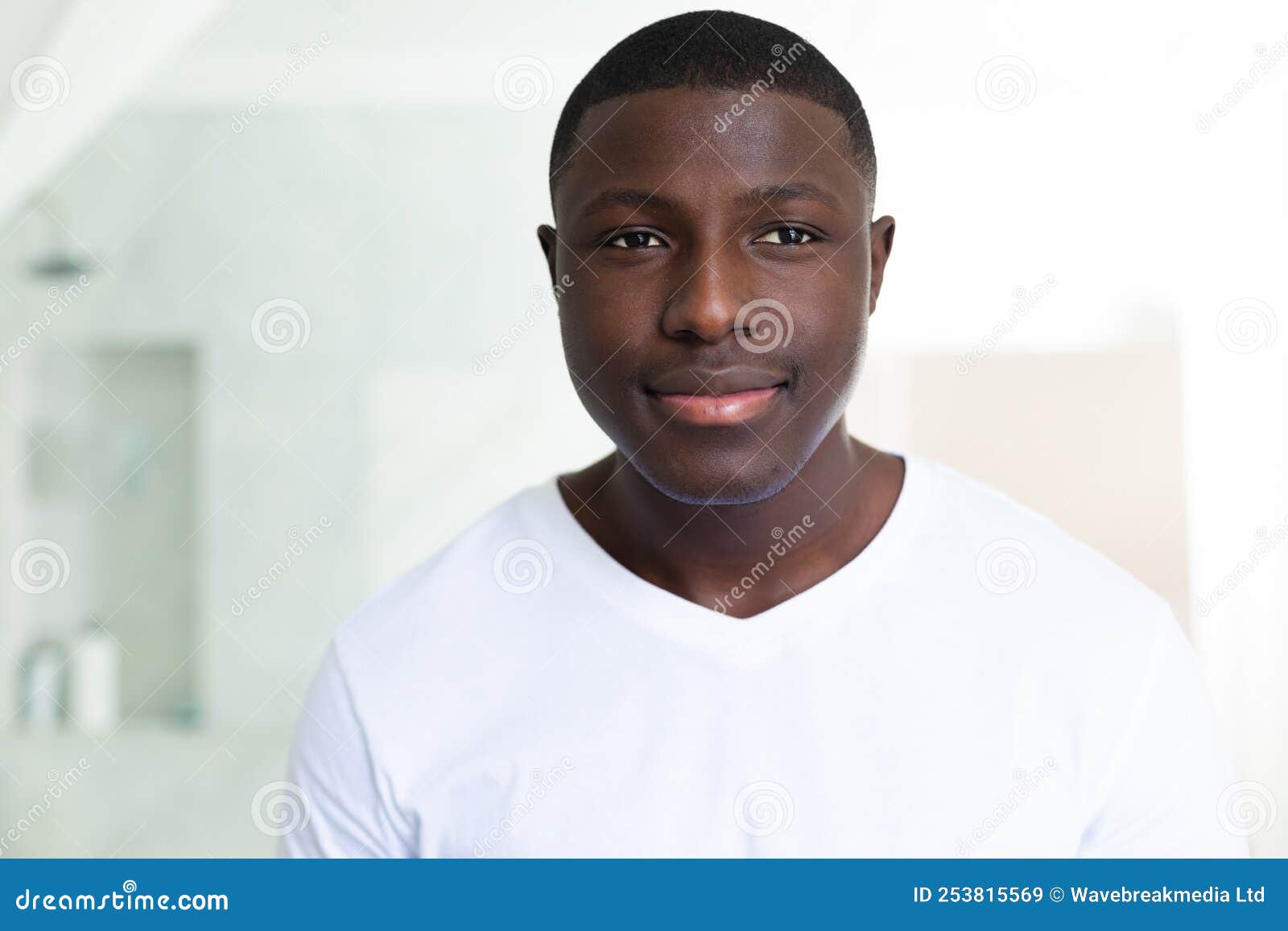 Portrait Of Happy African American Man Smiling In Bathroom Stock Image
