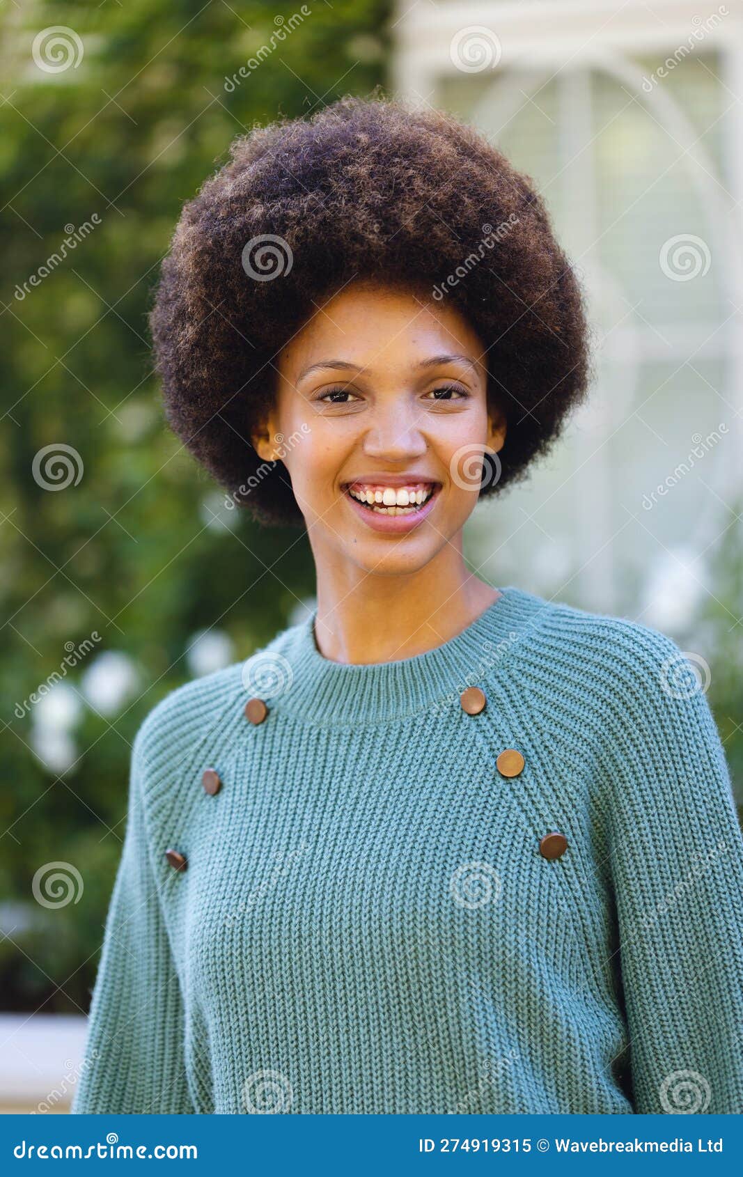 Portrait Of Happy African American Woman Looking At Camera And Smiling