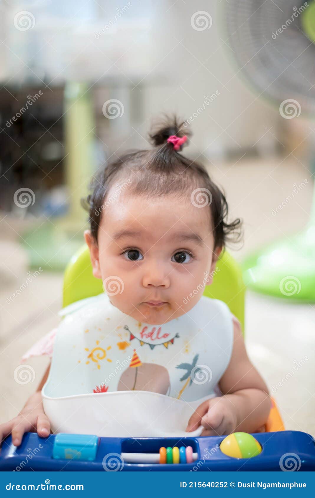 Portrait of Happy Asian Baby Sitting on the Dining Table, Looking at ...
