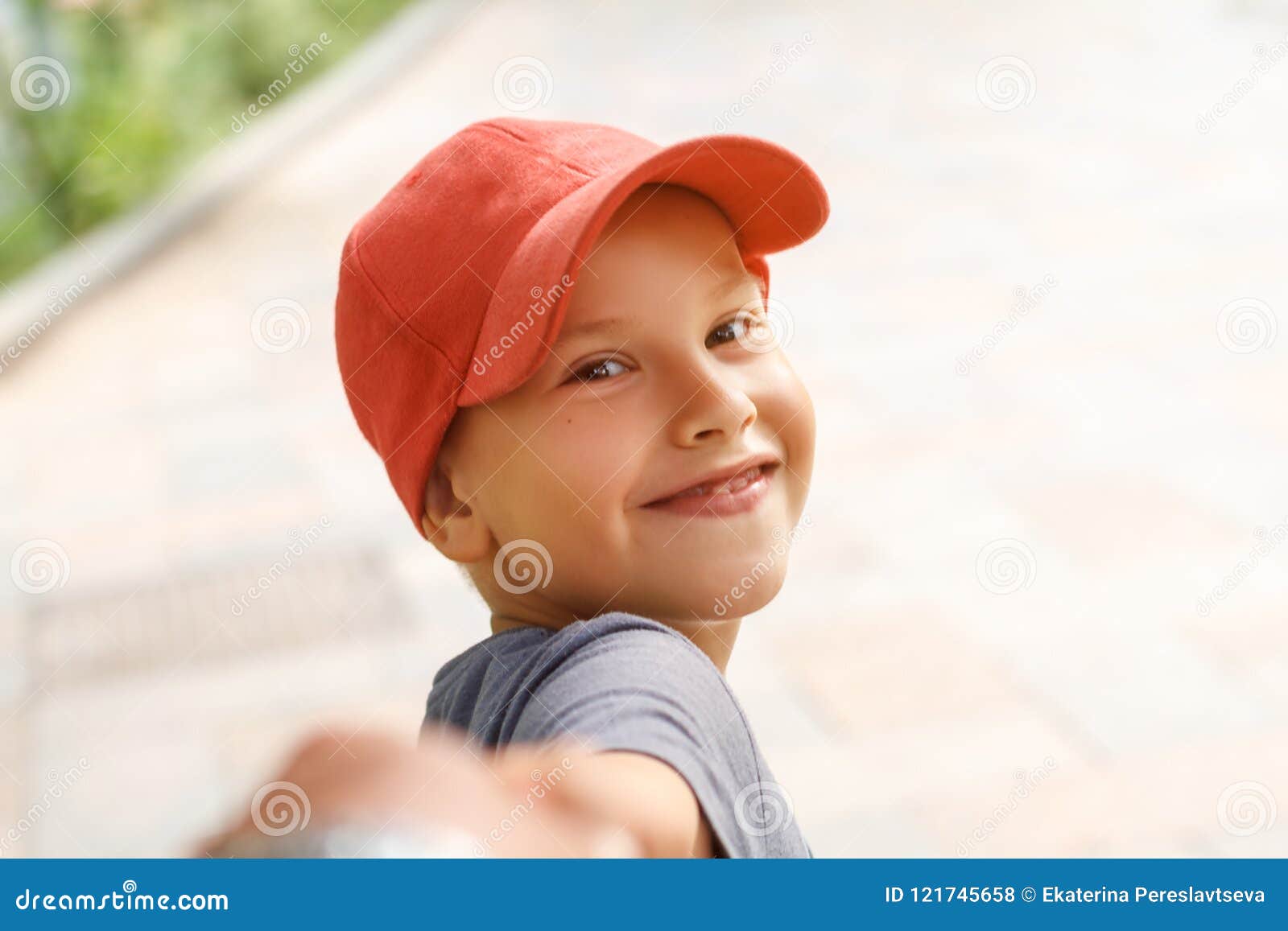 Portrait of Happy Boy in Cap Holding Smiling and Holding Hand Stock ...