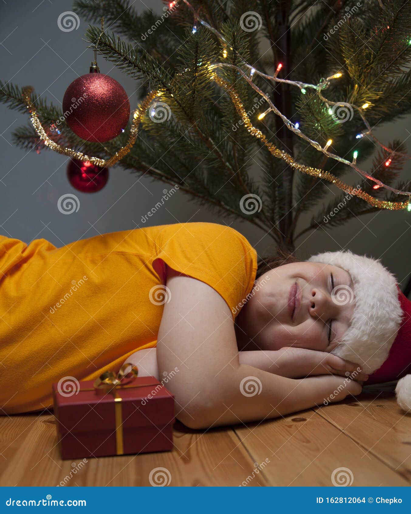 Portrait of Happy Boy Sleep Under Christmas Tree Stock Photo - Image of ...