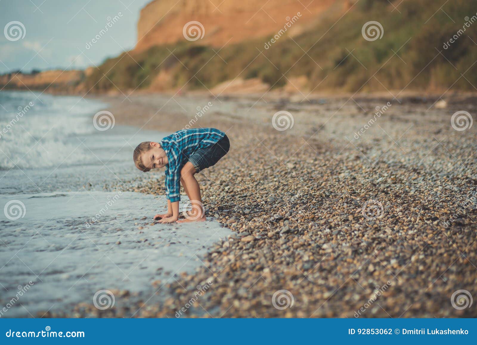 Portrait of Happy Boy Standing Alone at Beach Stock Photo - Image of ...
