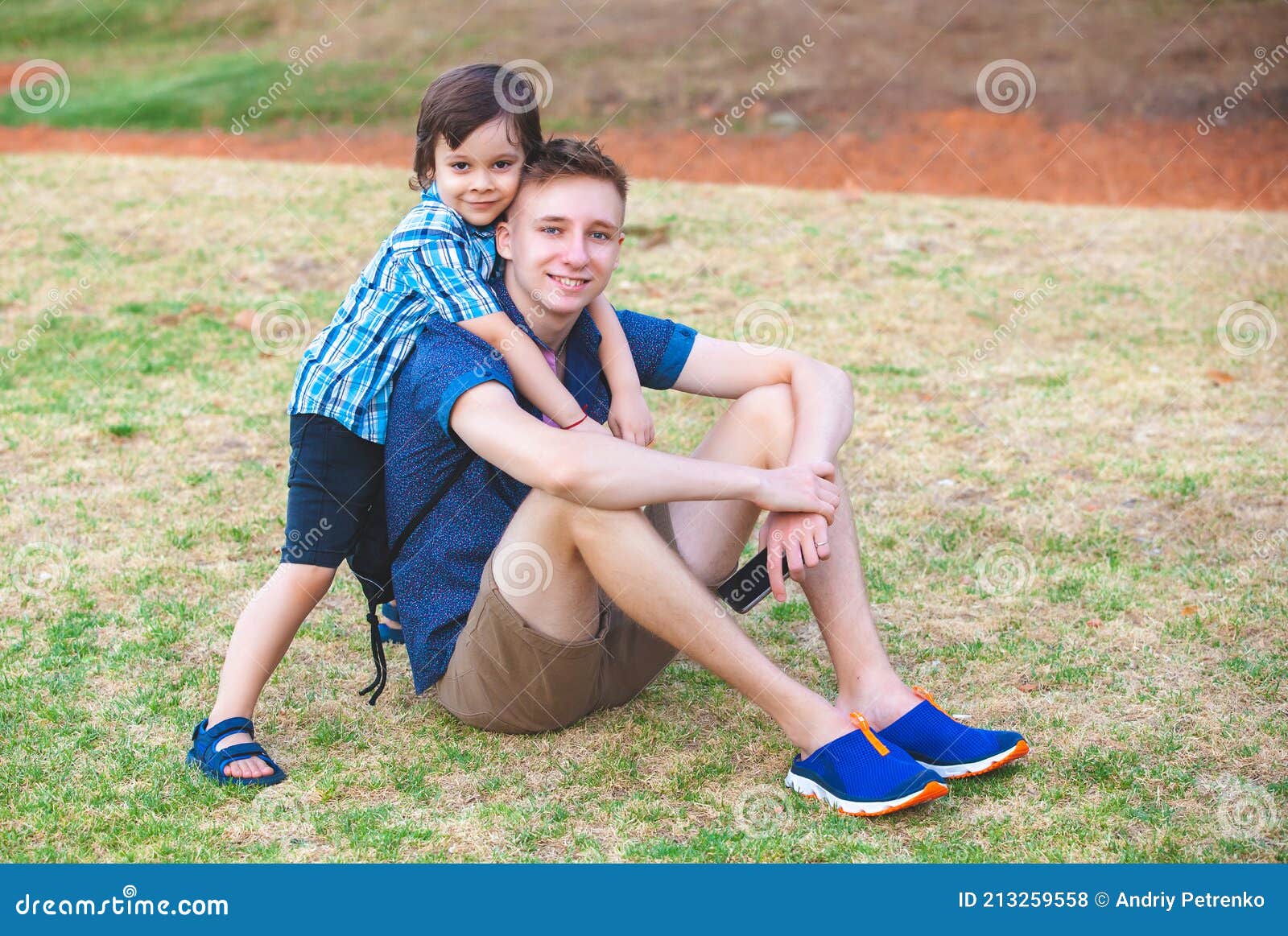 Portrait of Happy Brothers in the Park Stock Photo - Image of field ...