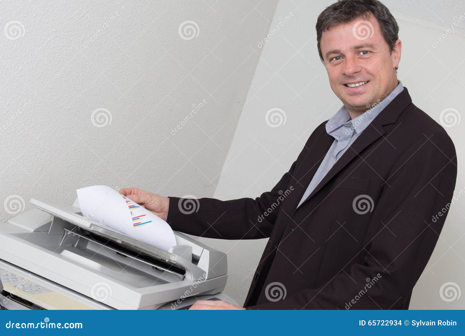Portrait of a Happy Business Man Using Machine Stock Photo - Image of ...