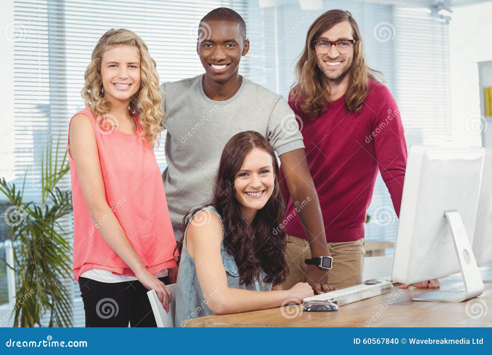 Portrait of Happy Business Team Working at Computer Desk Stock Photo ...