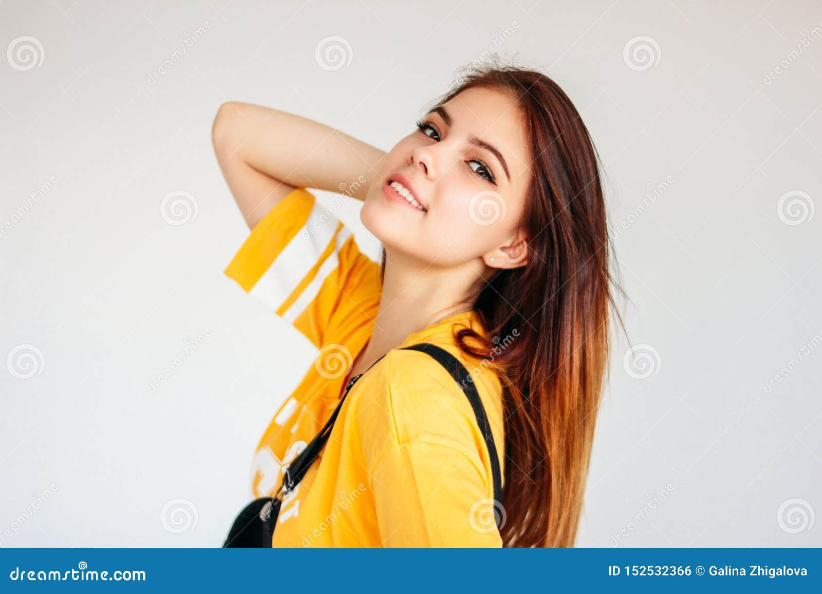 Portrait Of Happy Carefree Smiling Teenager Girl With Dark Long Hair In