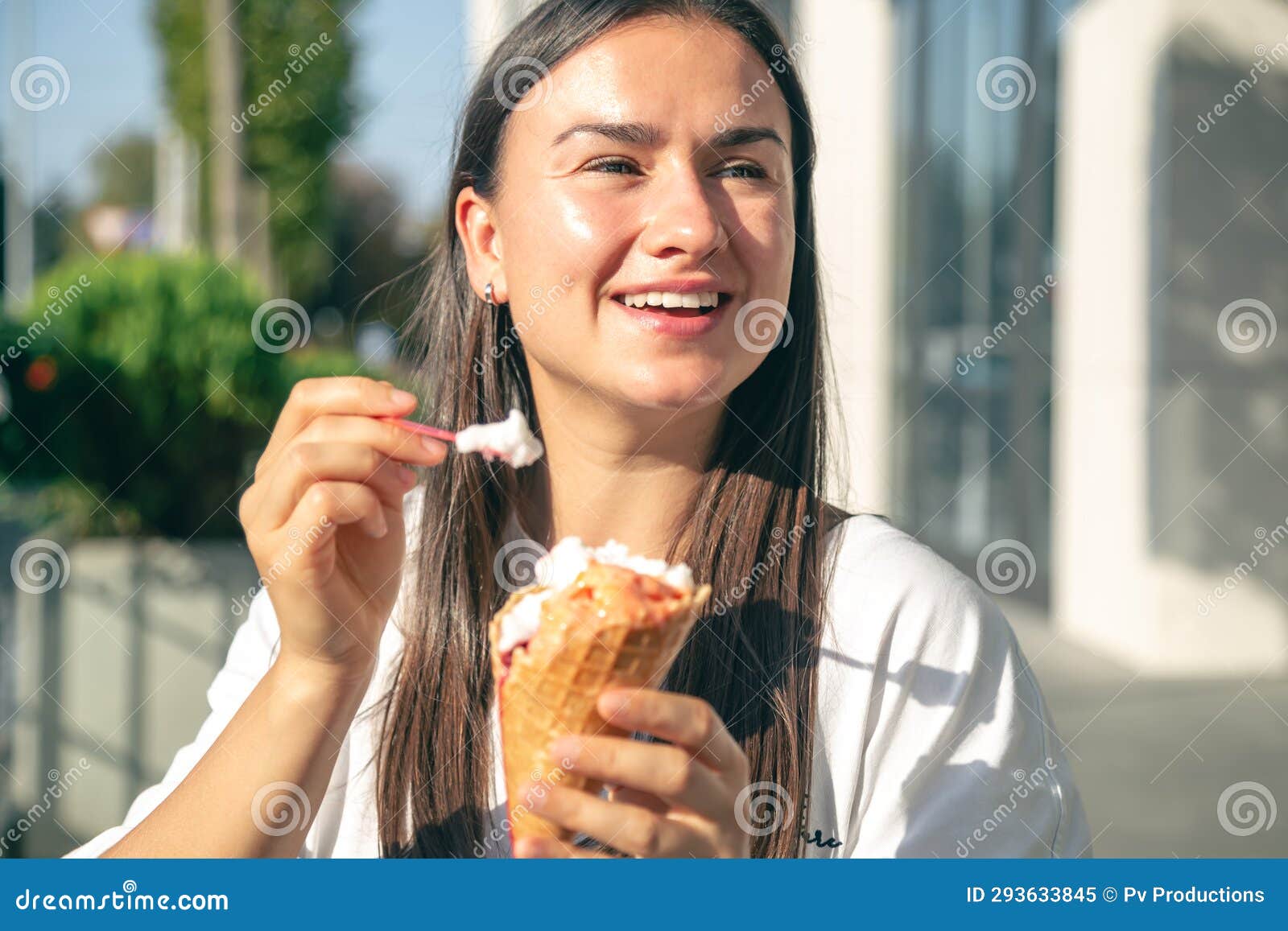 Portrait Of Happy Caucasian Brunette Woman Eating Ice Cream Cone