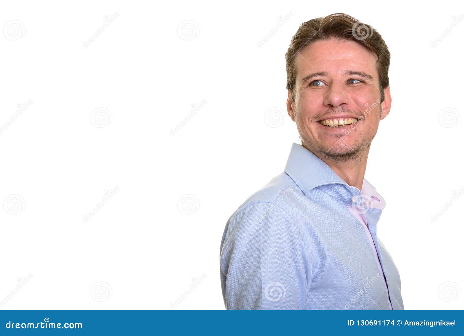Portrait Of Happy Caucasian Businessman Smiling And Looking Over