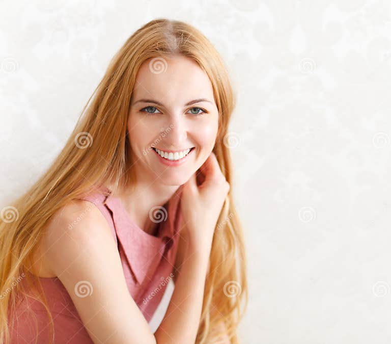 Portrait Of Happy Cheerful Smiling Young Beautiful Blond Woman Stock