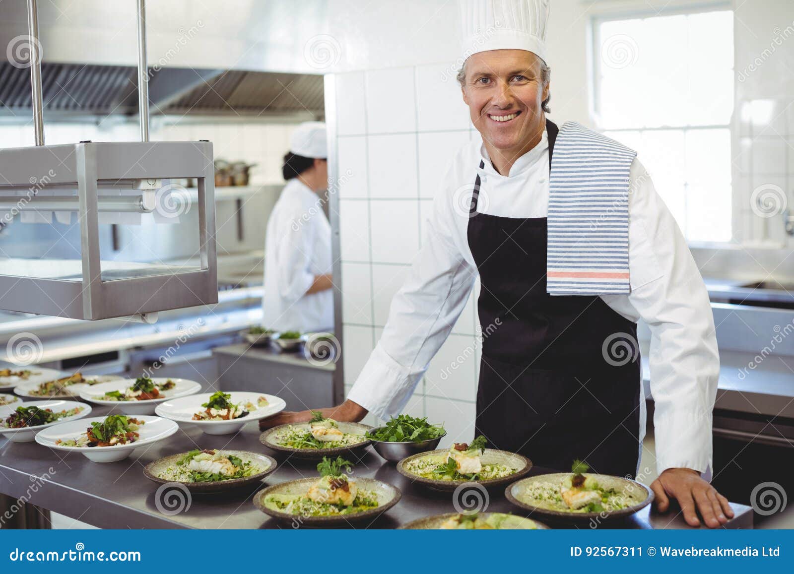 Portrait of Happy Chef with Appetizer Plates at Order Station Stock ...