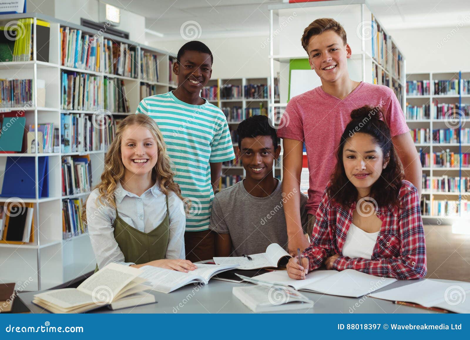 Portrait of Happy Classmates Studying in Library Stock Image - Image of ...