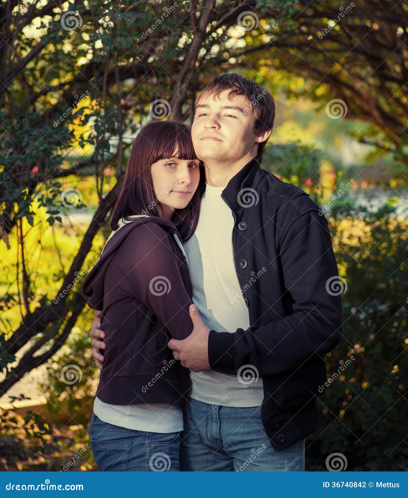 Portrait of a Happy Couple... Stock Photo - Image of green, embracing ...