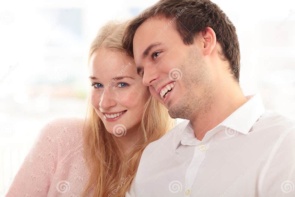 Portrait Of A Happy Couple Sitting Together Stock Image Image Of