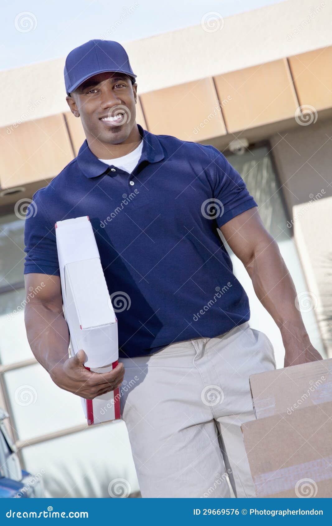 Portrait of a Happy Delivery Man Carrying Packages Stock Photo - Image ...
