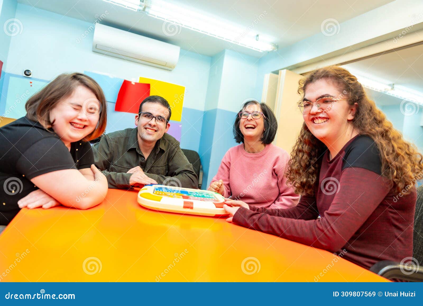 Portrait of Happy Disabled People Playing Board Games Stock Image ...