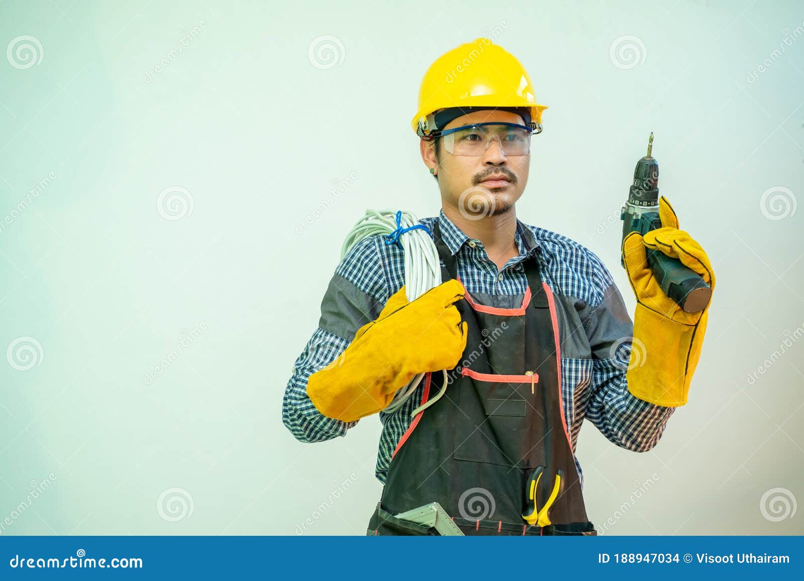 Portrait of an Happy Electrician on White Studio. Stock Photo - Image ...