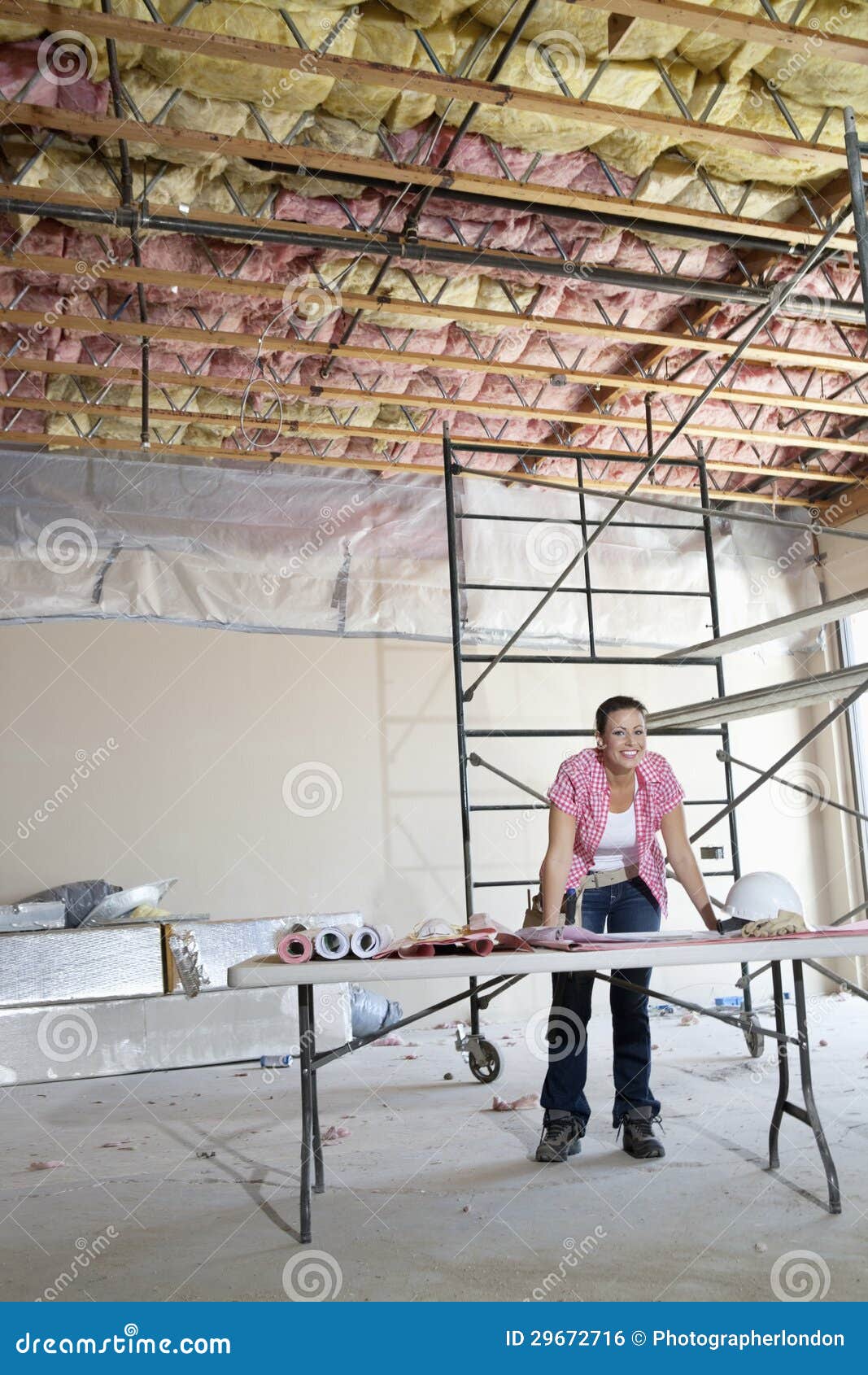 Portrait of Happy Female Contractor with Building Plans Stock Photo ...