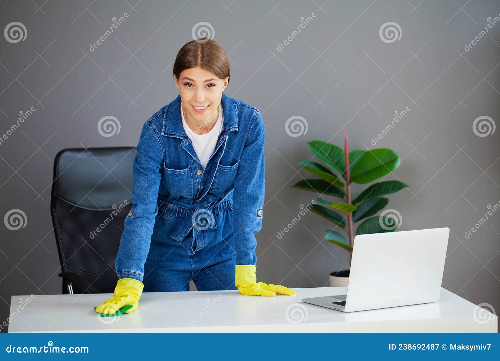 Portrait of Happy Female Worker Cleaning Computer Desk Stock Image ...