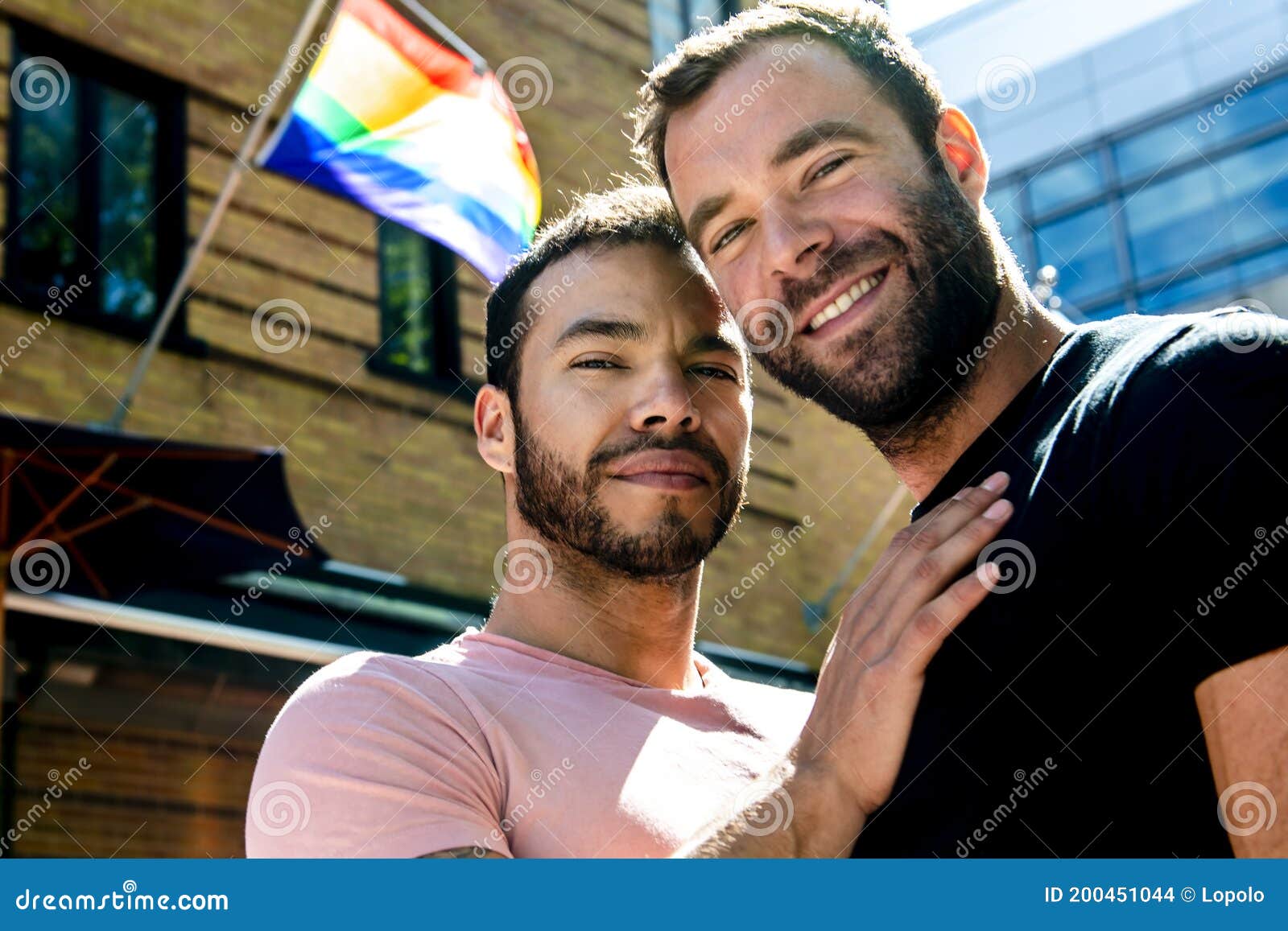 A Portrait Of A Happy Gay Couple Outdoors In Urban Background Stock