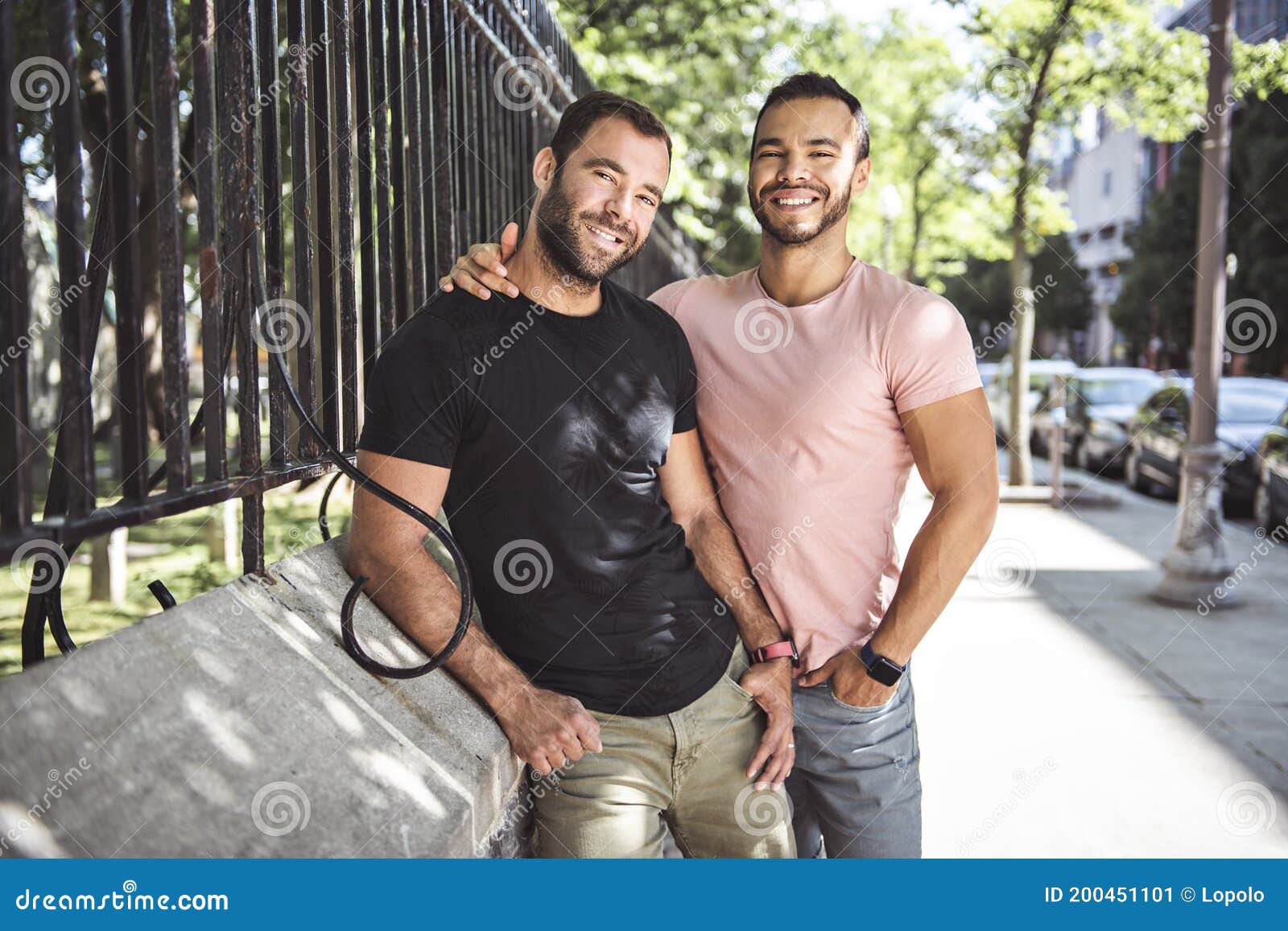 A Portrait Of A Happy Gay Couple Outdoors In Urban Background Stock