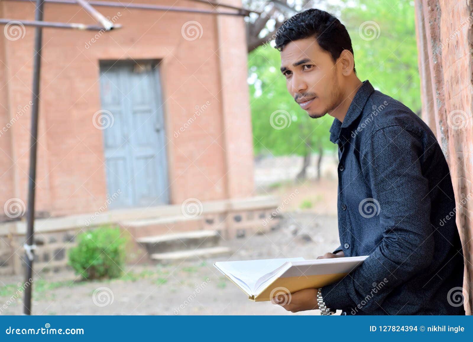 Portrait of Happy Young Man Reading Book Outdoor Stock Photo - Image of ... Portrait of Happy Young Man Reading Book Outdoor Stock Photo - Image of ...