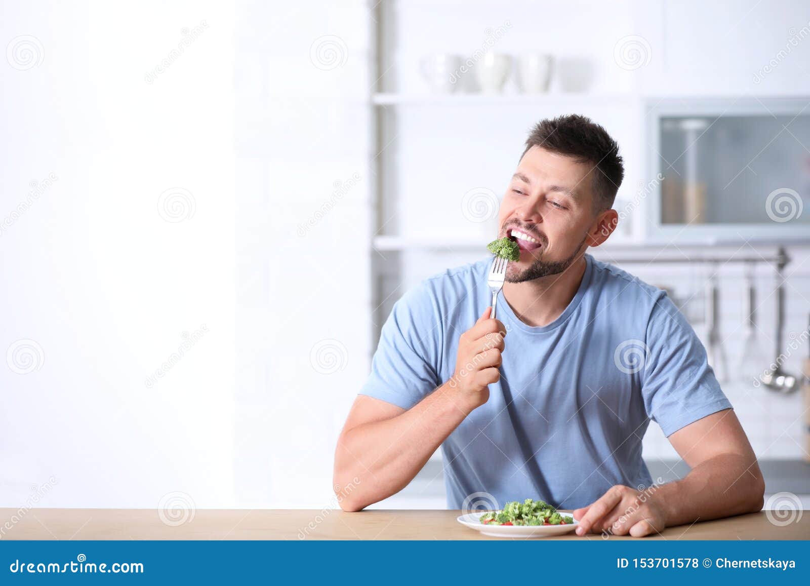 Portrait of Happy Man Eating Broccoli Salad Stock Photo - Image of ...