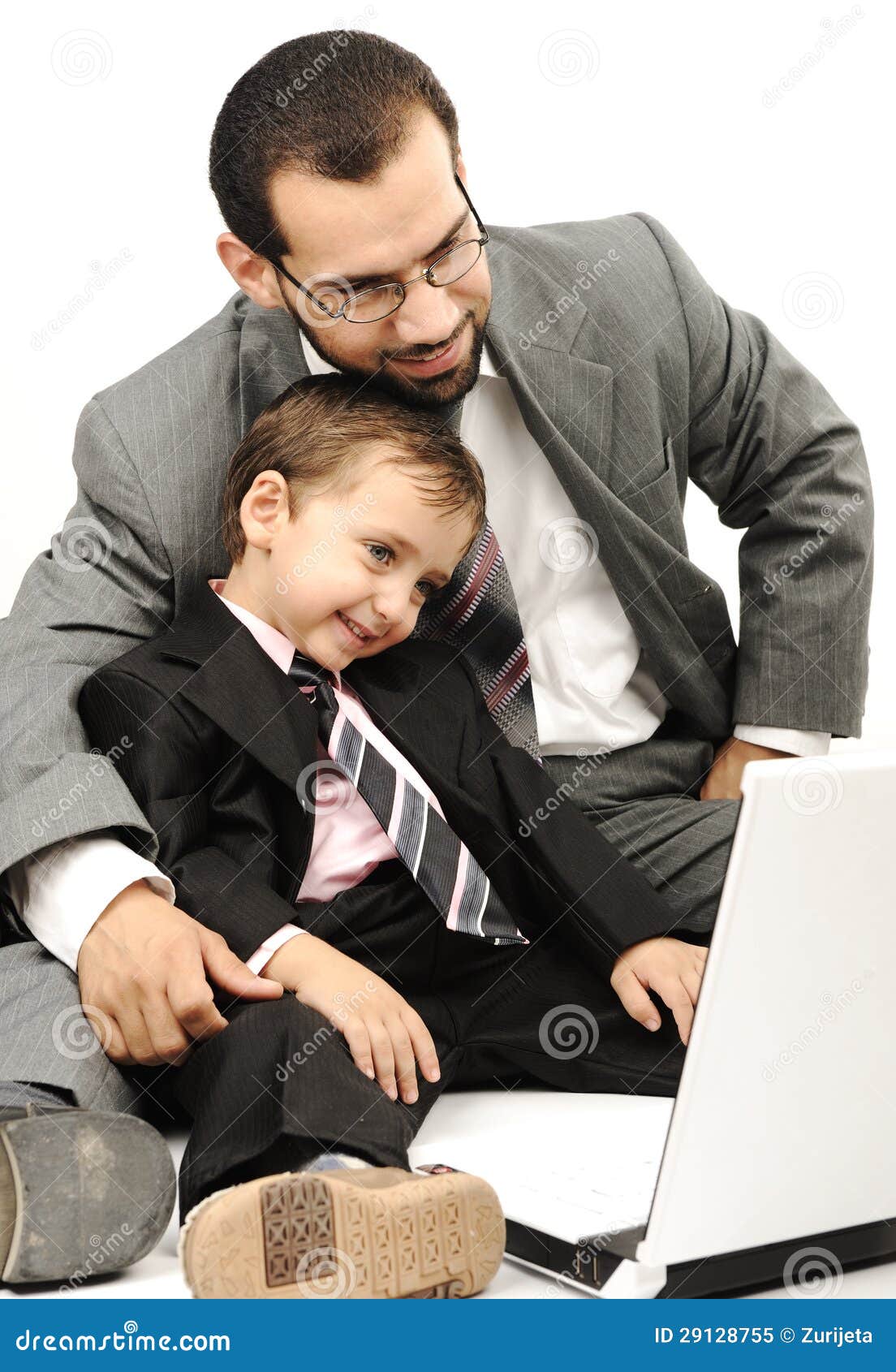 Portrait of a Happy Man and His Son Working on Laptop Stock Image ...