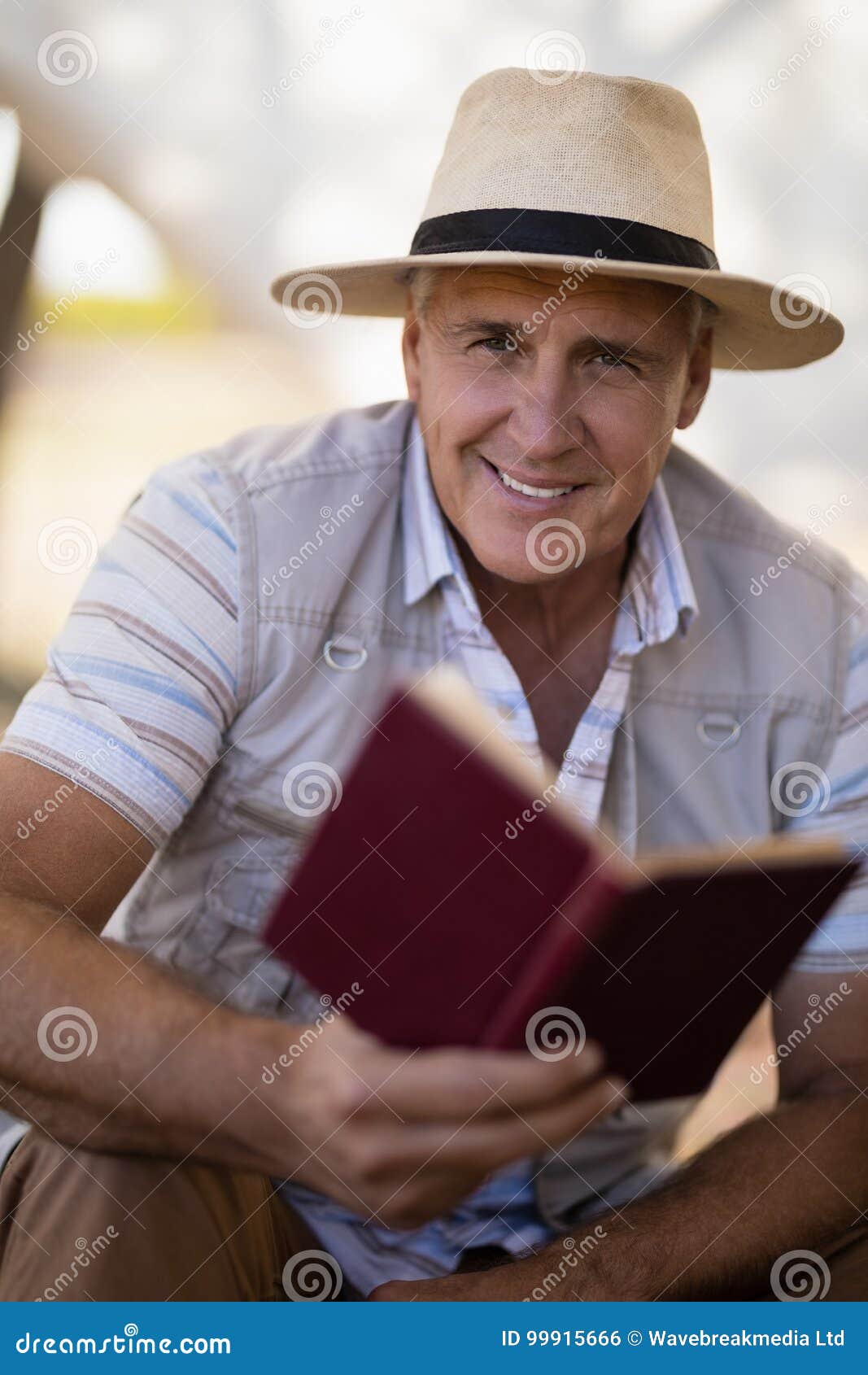 Portrait of Happy Man Reading Book in Cottage Stock Photo - Image of ... Portrait of Happy Man Reading Book in Cottage Stock Photo - Image of ...