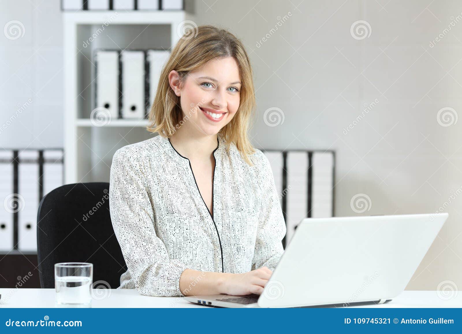 Office Employee Working and Looking at Camera Stock Image - Image of ...