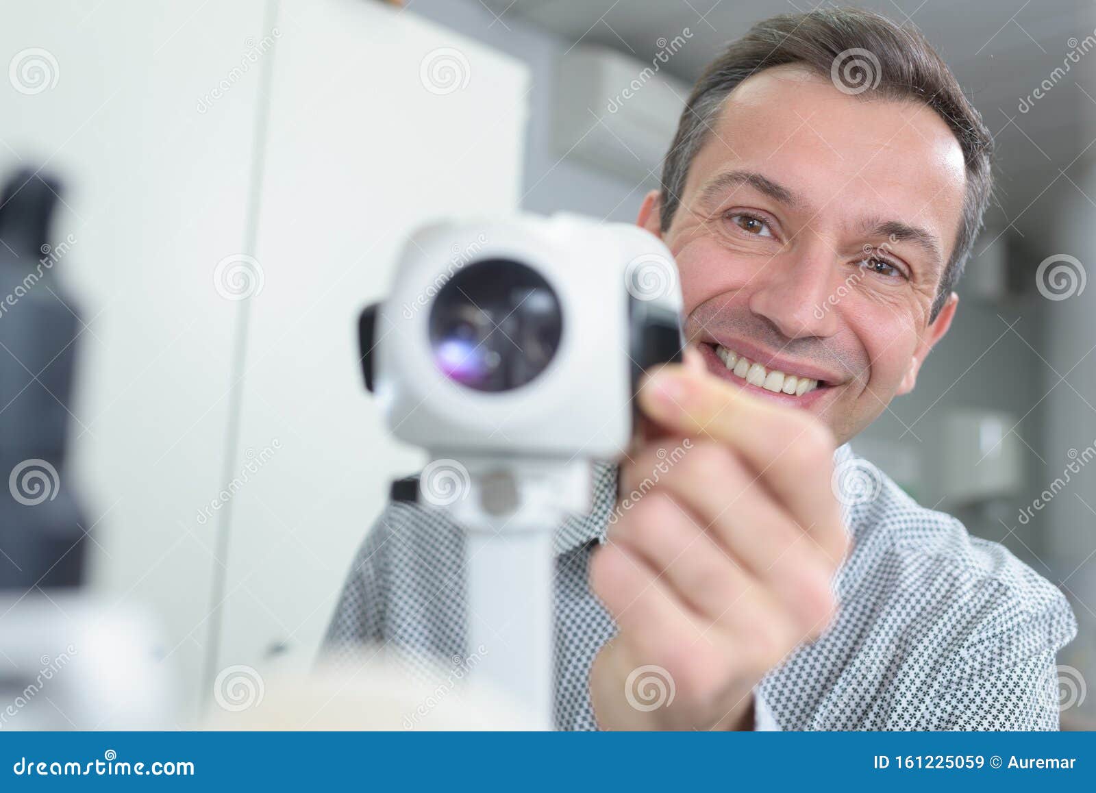 Portrait Happy Optician Using Slit Lamp in Clinic Stock Image - Image ...