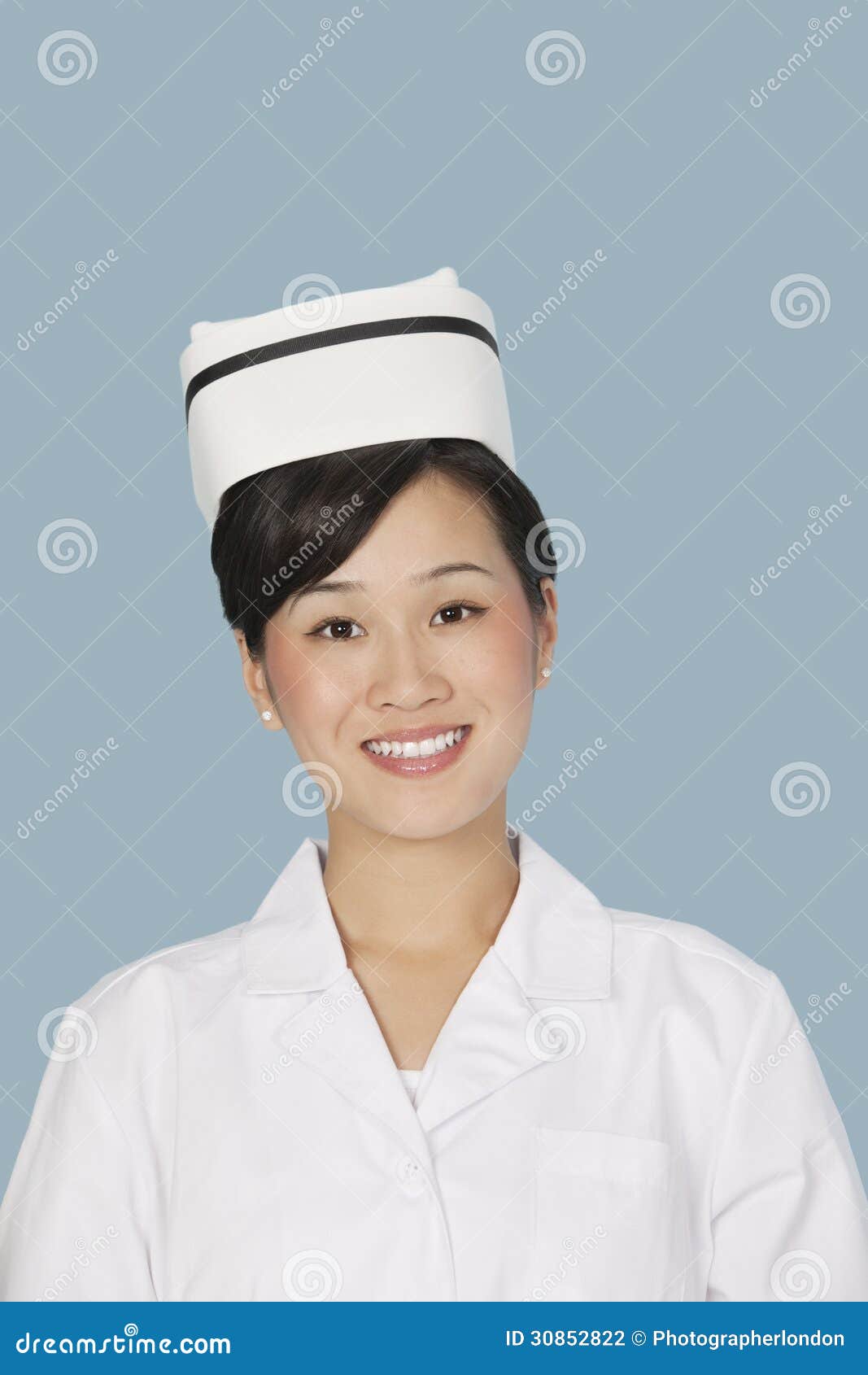 Portrait of a Happy Pretty Doctor Over Light Blue Background Stock ...