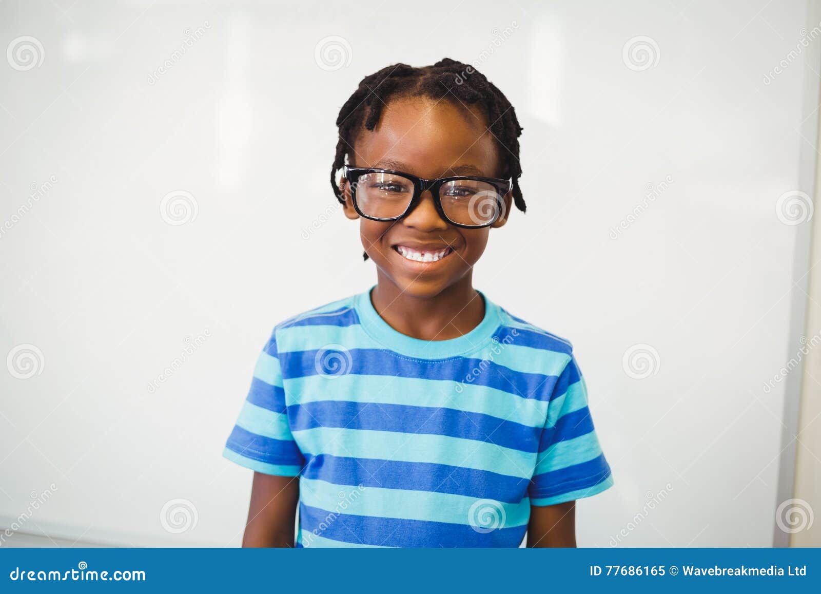 Portrait of Happy Schoolboy Smiling in Classroom Stock Image - Image of ...