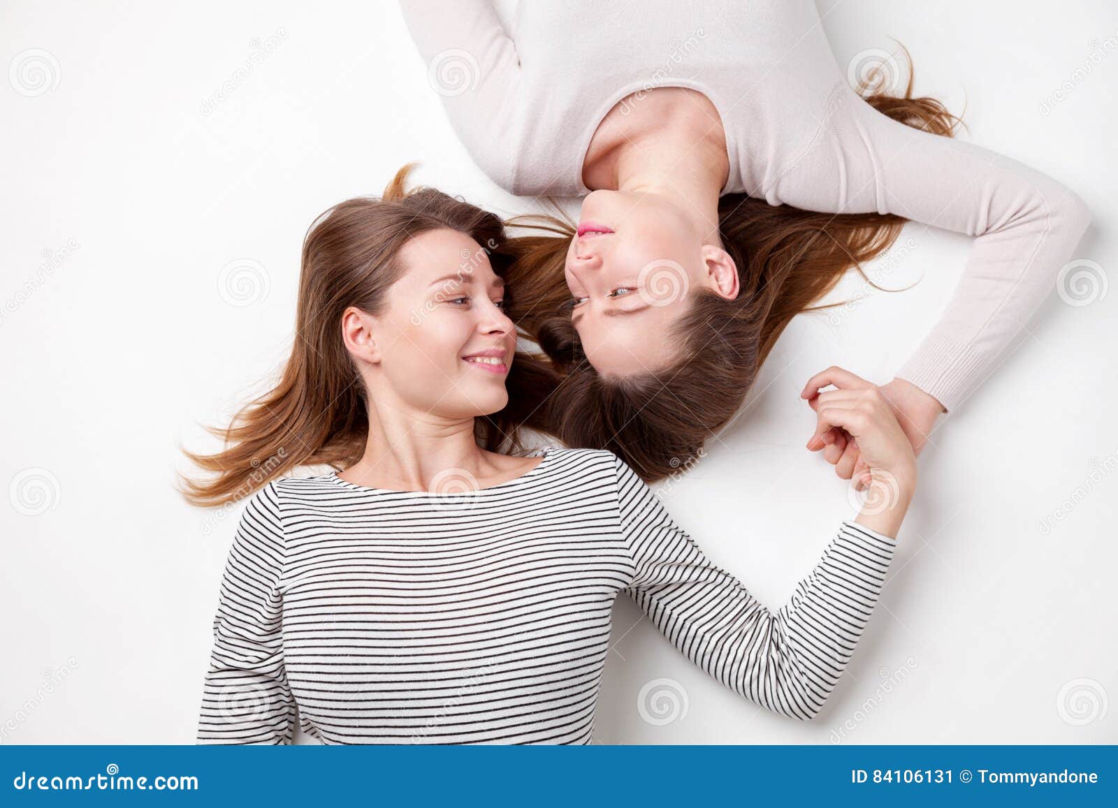 Portrait Of Happy Sisters Lying On The Floor Stock Image Image Of