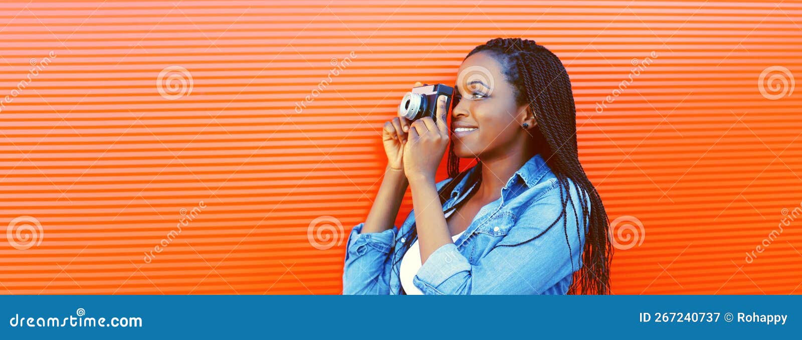 Portrait Of Happy Smiling African Woman Photographer With Film Camera