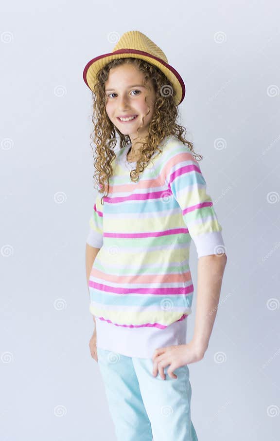 Portrait Of Happy Smiling Confident 9 Years Old Girl With Curly Hair